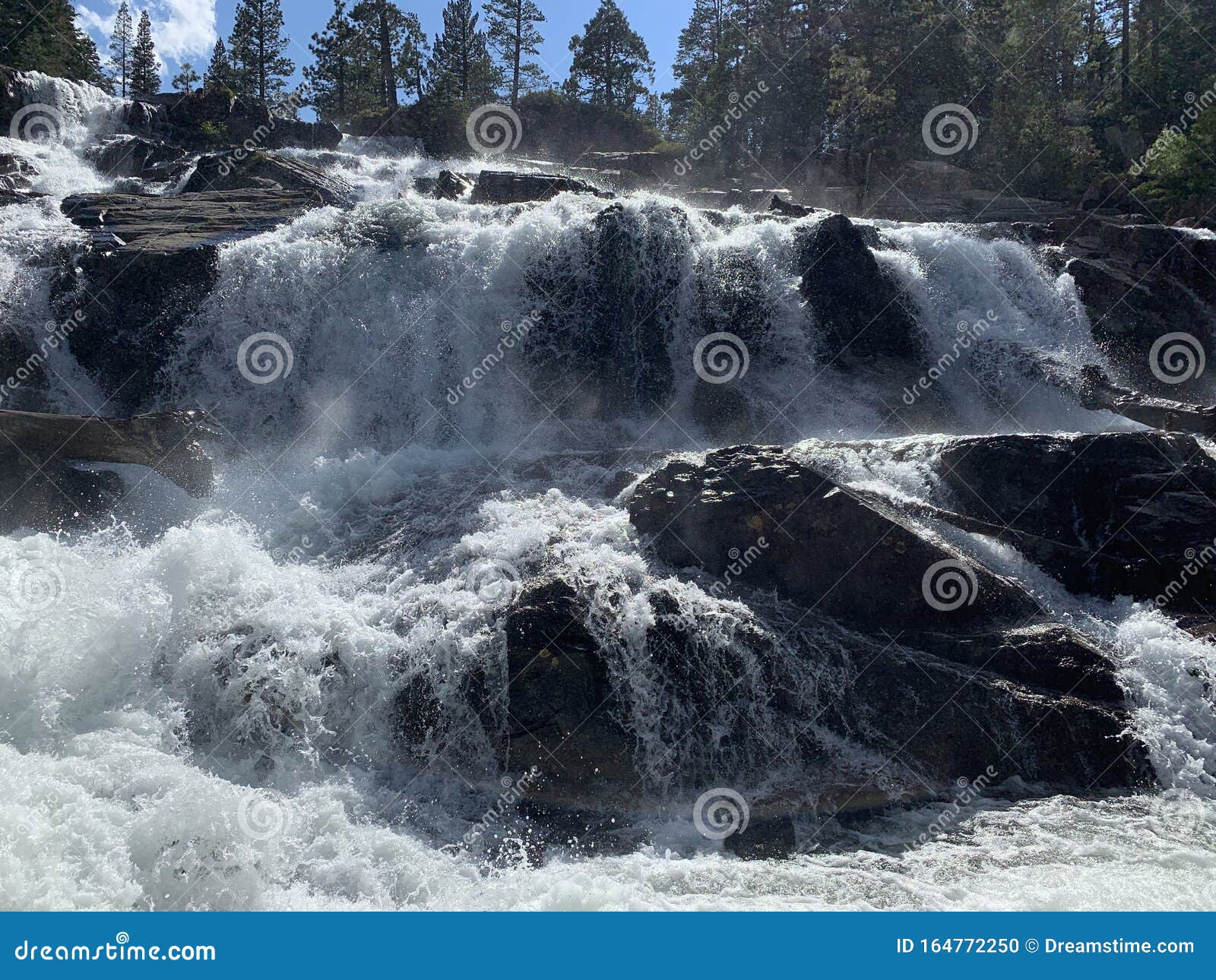 Spray of a Waterfall stock photo. Image of ripples, bushes - 164772250