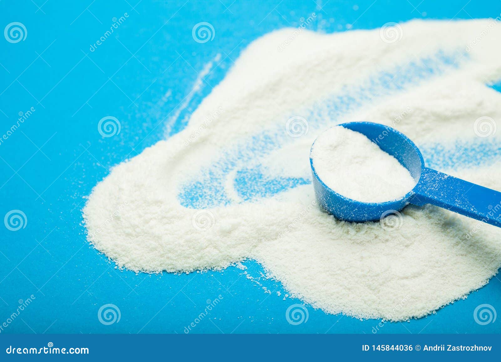 Sprayed Powdered Milk on a Blue Background Stock Photo - Image of full ...