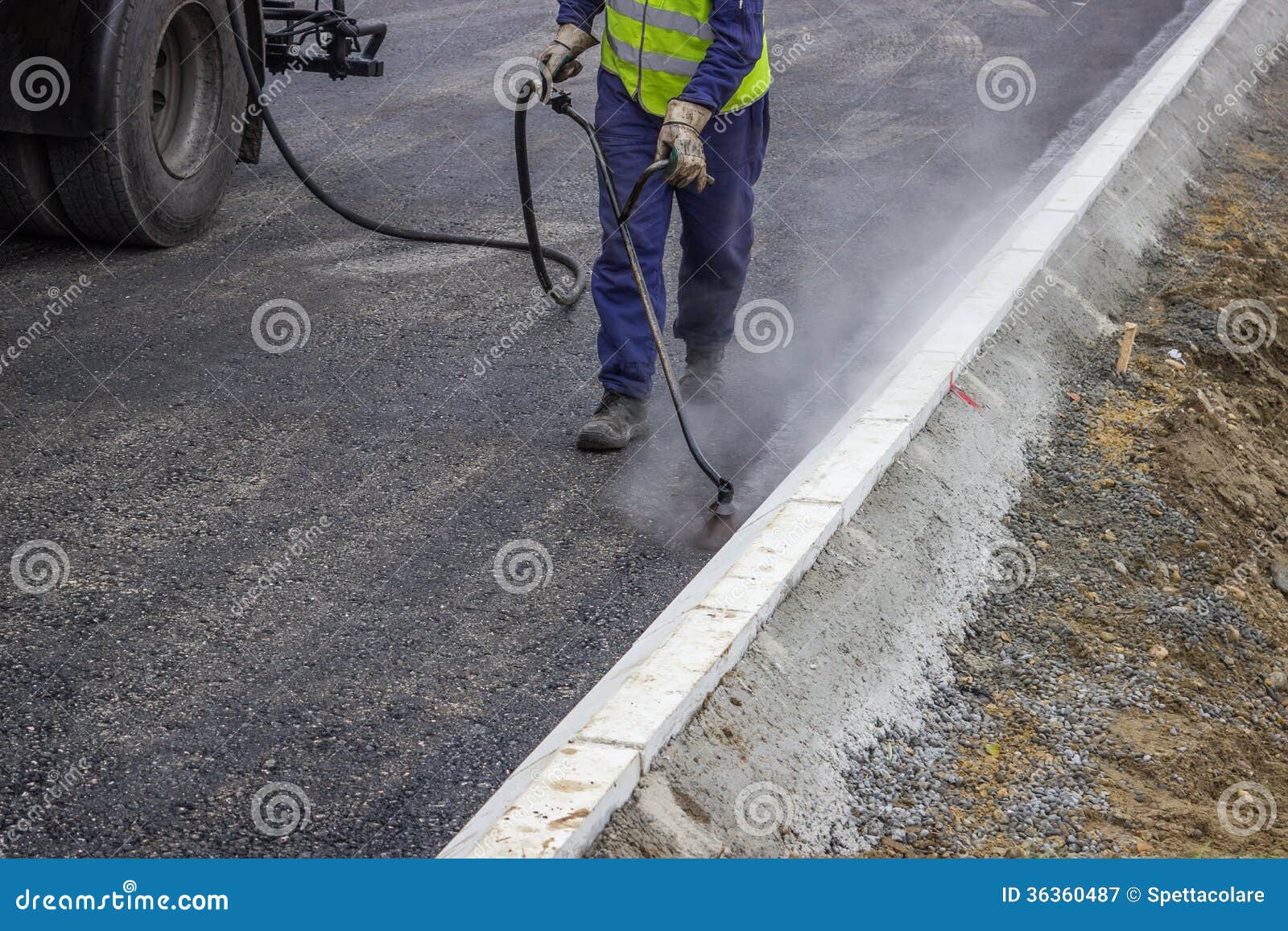 Spraying Bitumen Emulsion With The Hand Spray Lance Royalty Free Stock ...