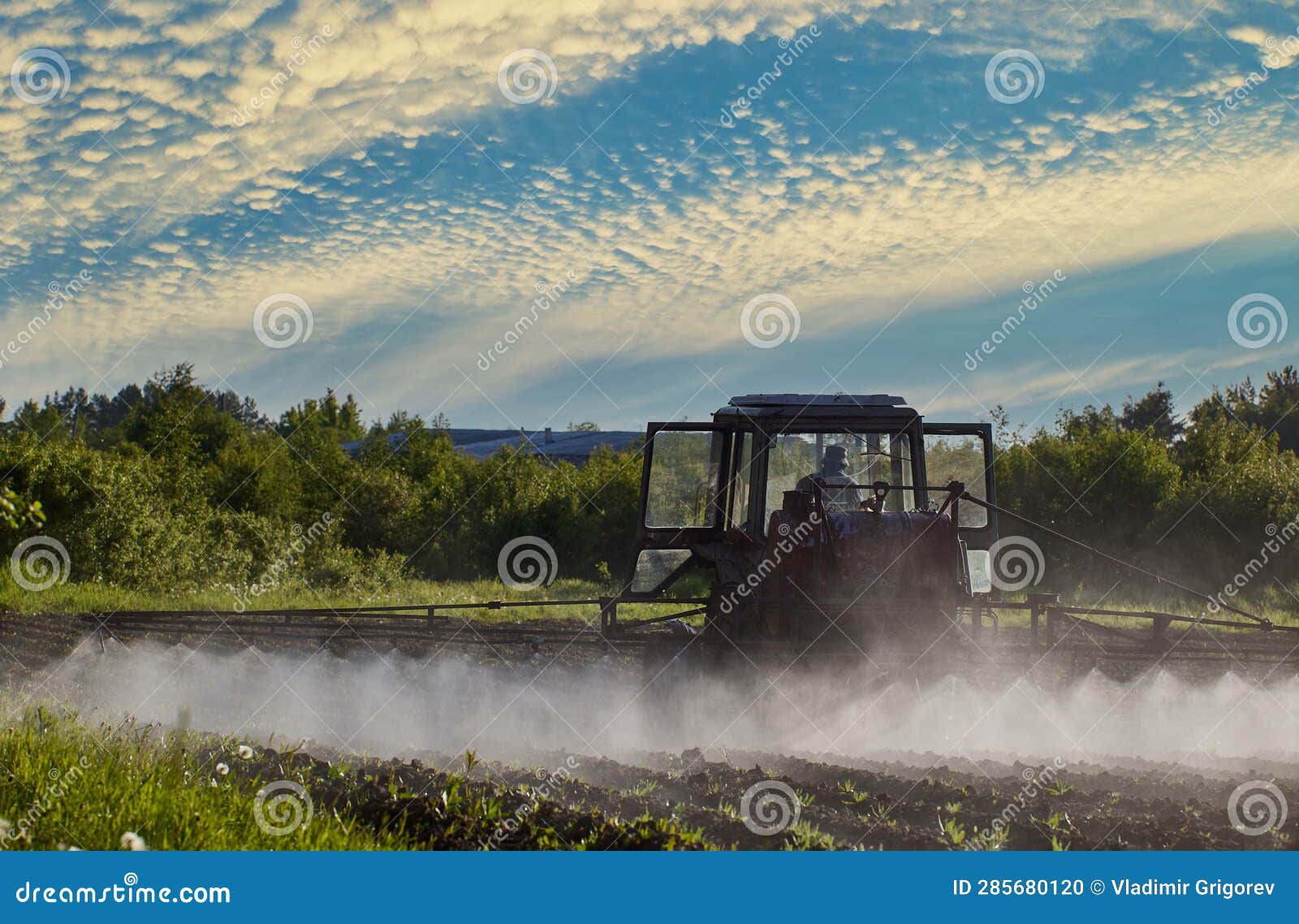 Spraying Crops with Herbicides Using Sprayer Mounted on Wheeled Tractor ...