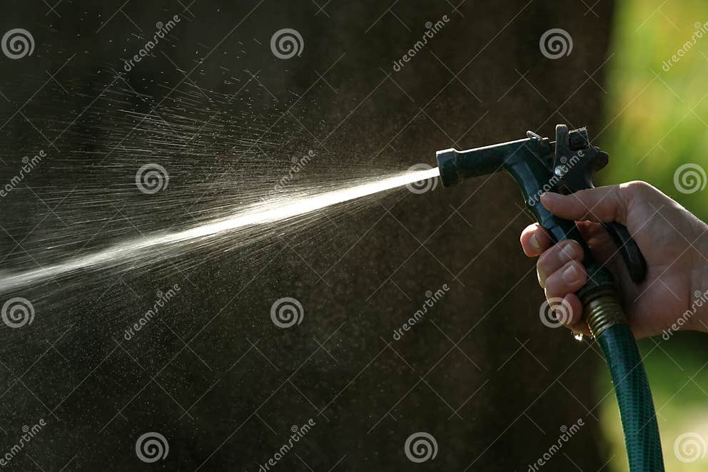 Spraying Hose stock image. Image of outside, green, hand - 33247