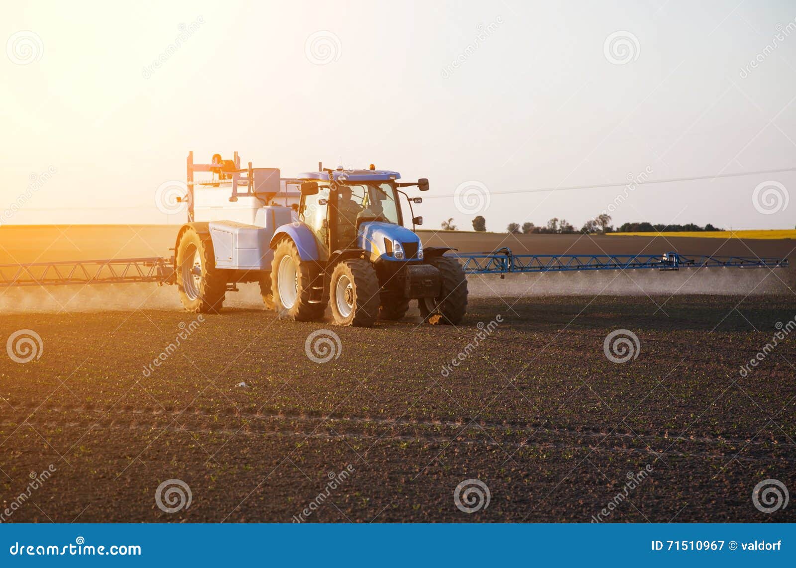 Spraying Machine Working on the Green Field Stock Image - Image of ...
