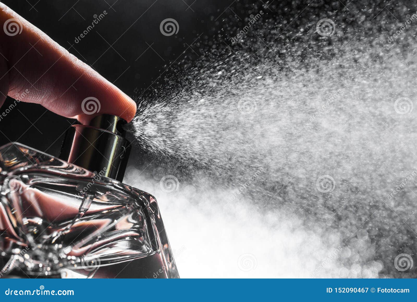 Spraying Perfume on Dark Background, Closeup Stock Image - Image of ...