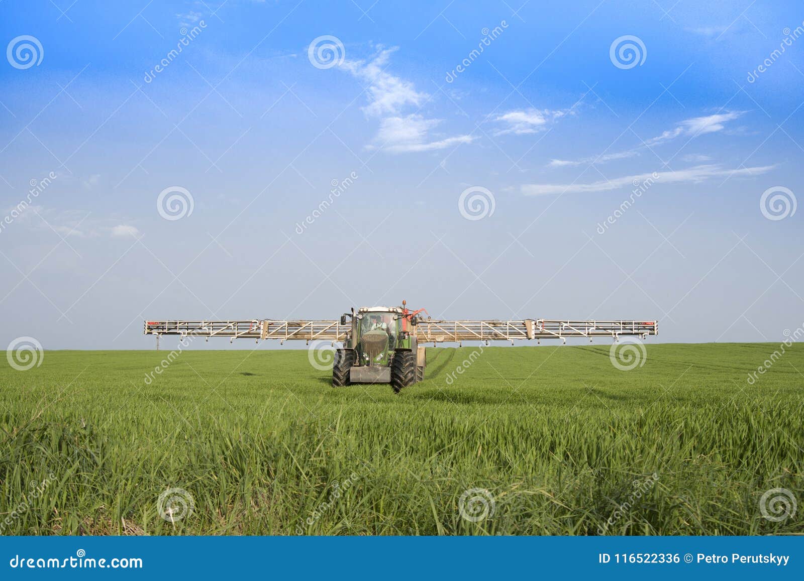 Spraying wheat field stock photo. Image of pesticide - 116522336
