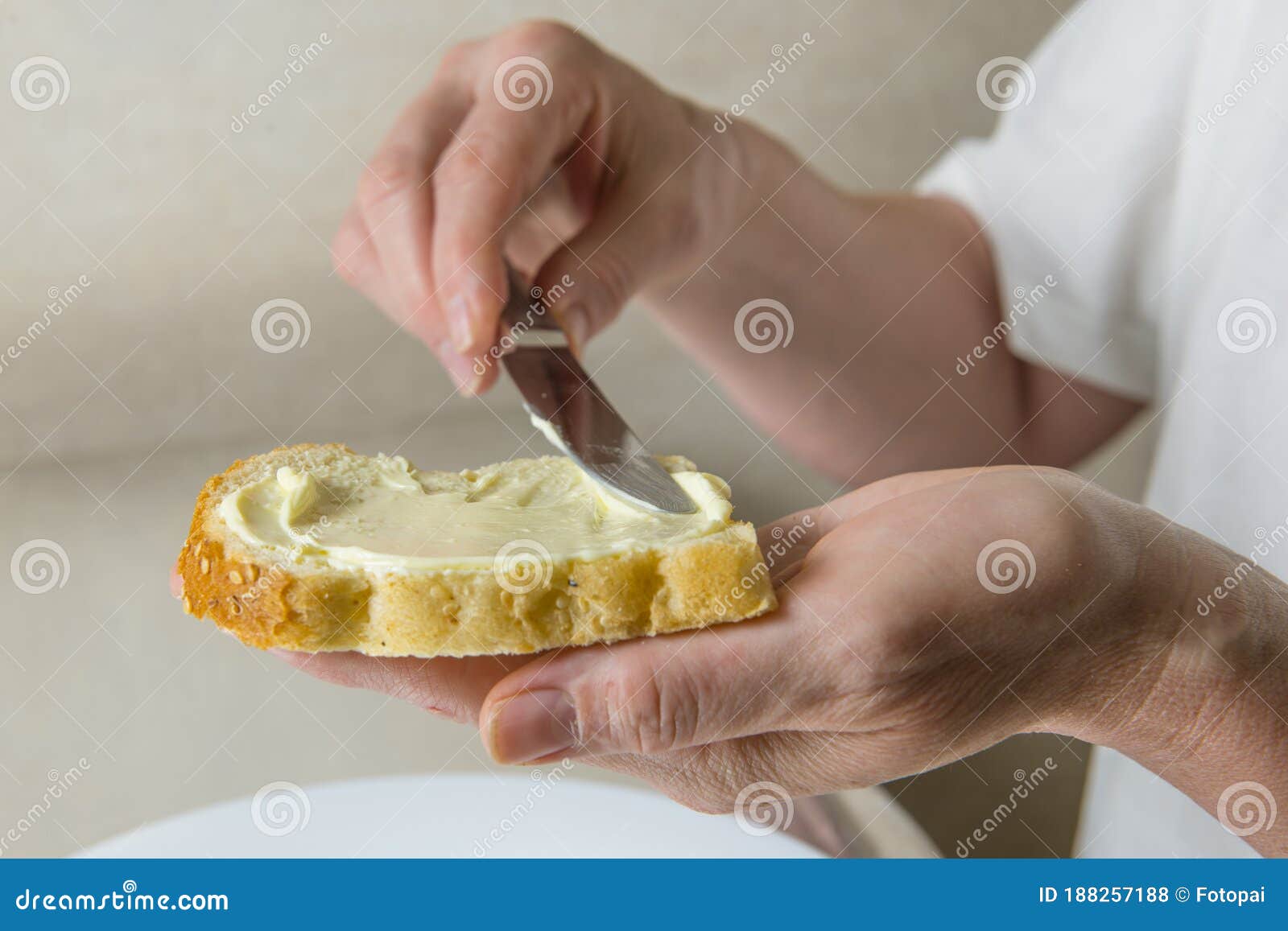 Spread butter on bread stock photo. Image of buttered - 188257188