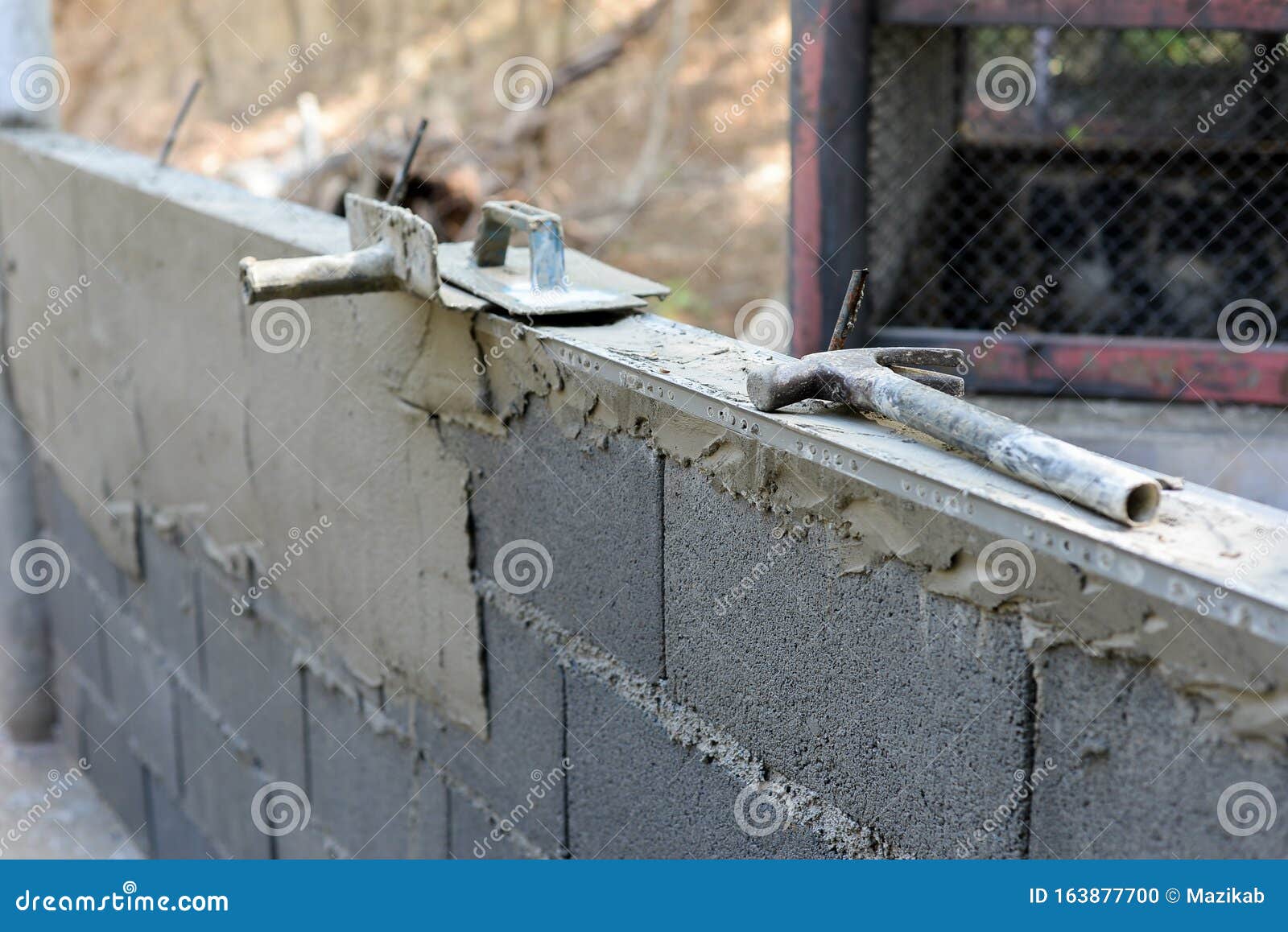 Spread cement on bricks stock photo. Image of cover - 163877700