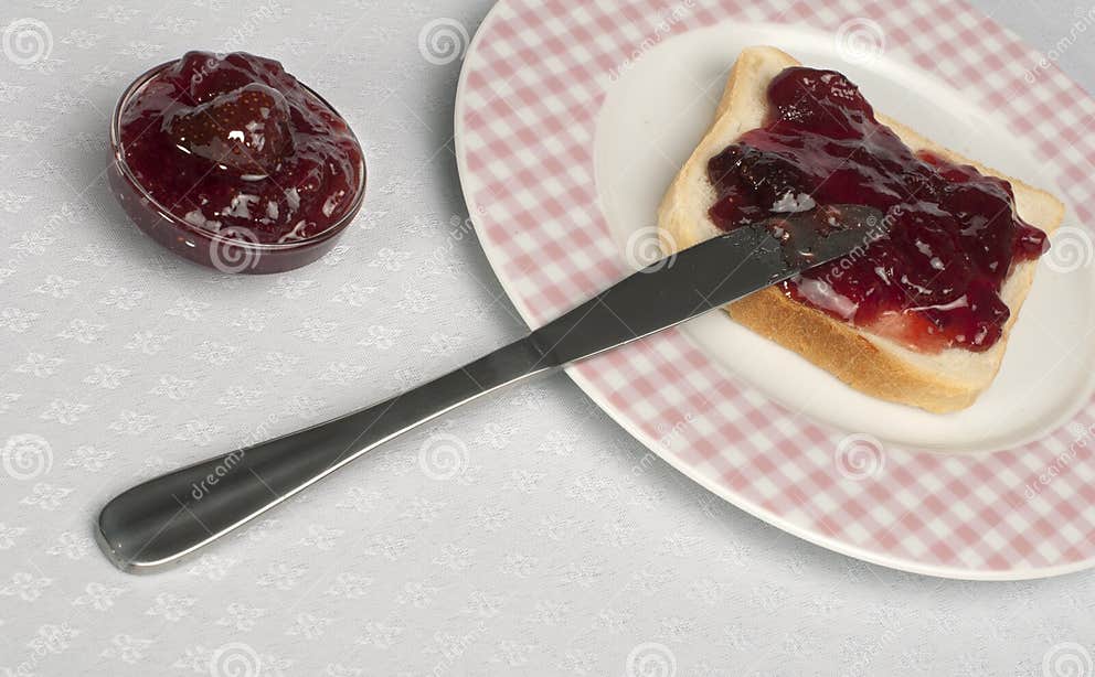 Spread jam on bread stock photo. Image of delicious, fruity - 28379666