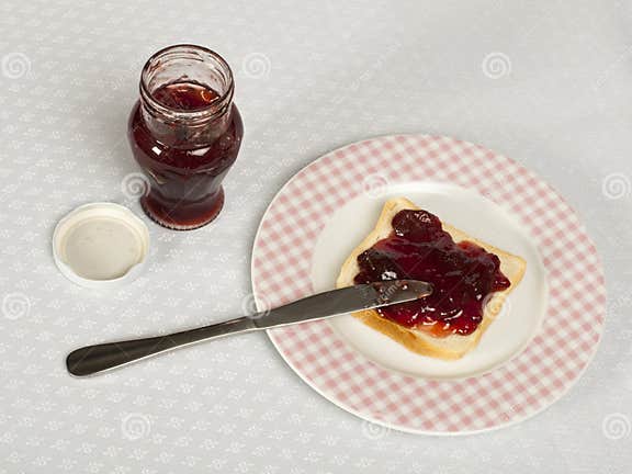 Spread jam on bread stock photo. Image of canned, gourmet - 28379672