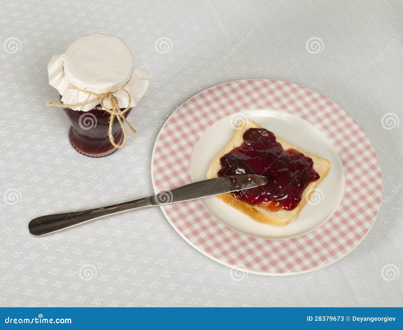 Spread jam on bread stock image. Image of ingredient - 28379673