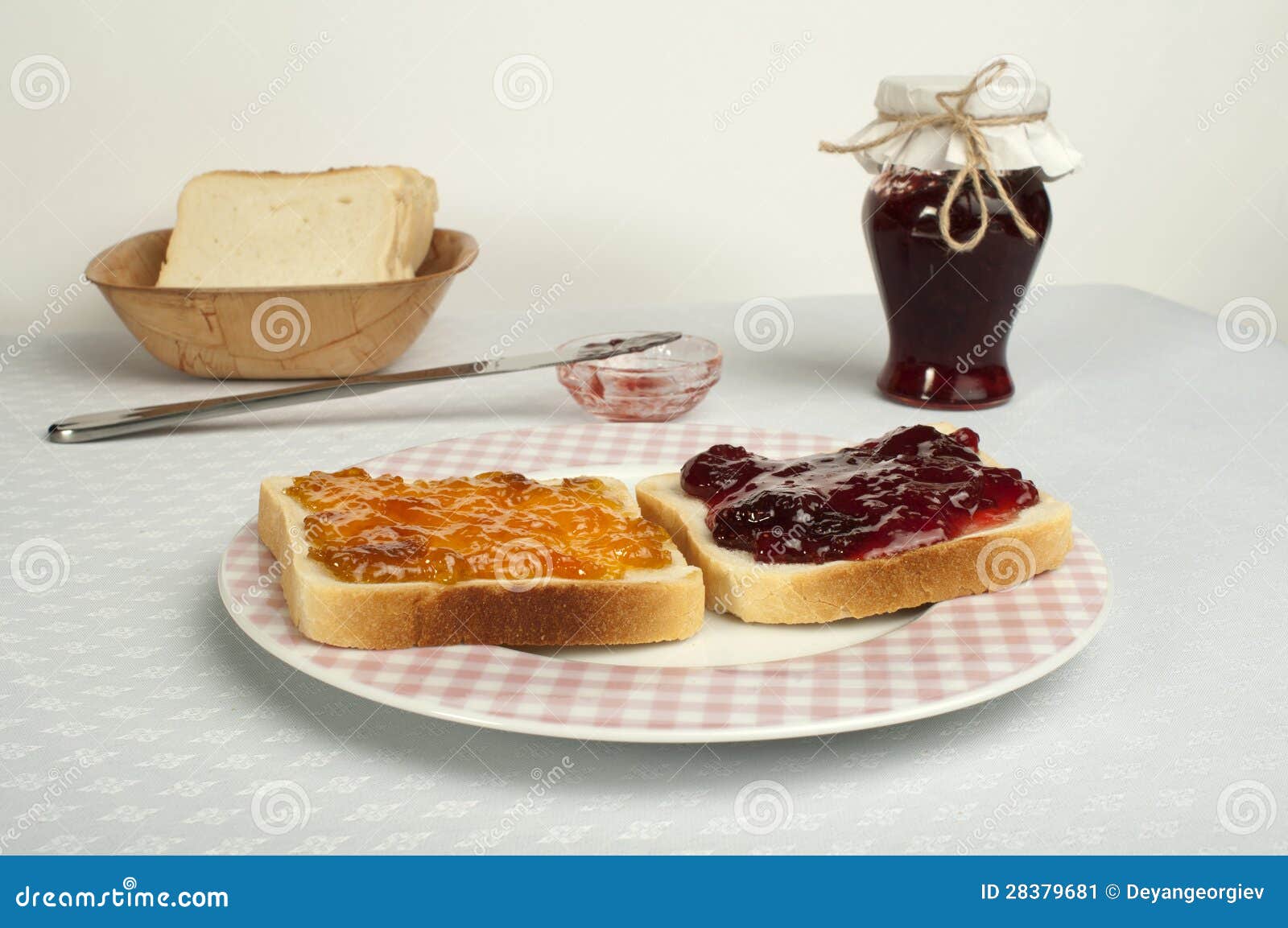 Spread jam on bread stock image. Image of gourmet, knife - 28379681