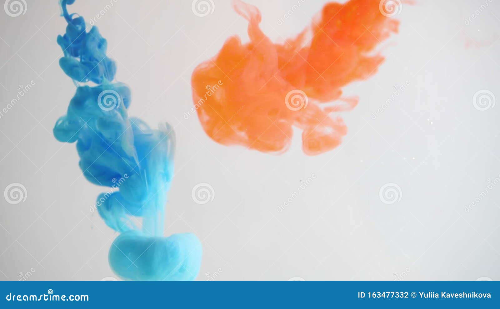 Diffusion of Orange and Blue Paint in Water. Abstract Colourful Smoke ...