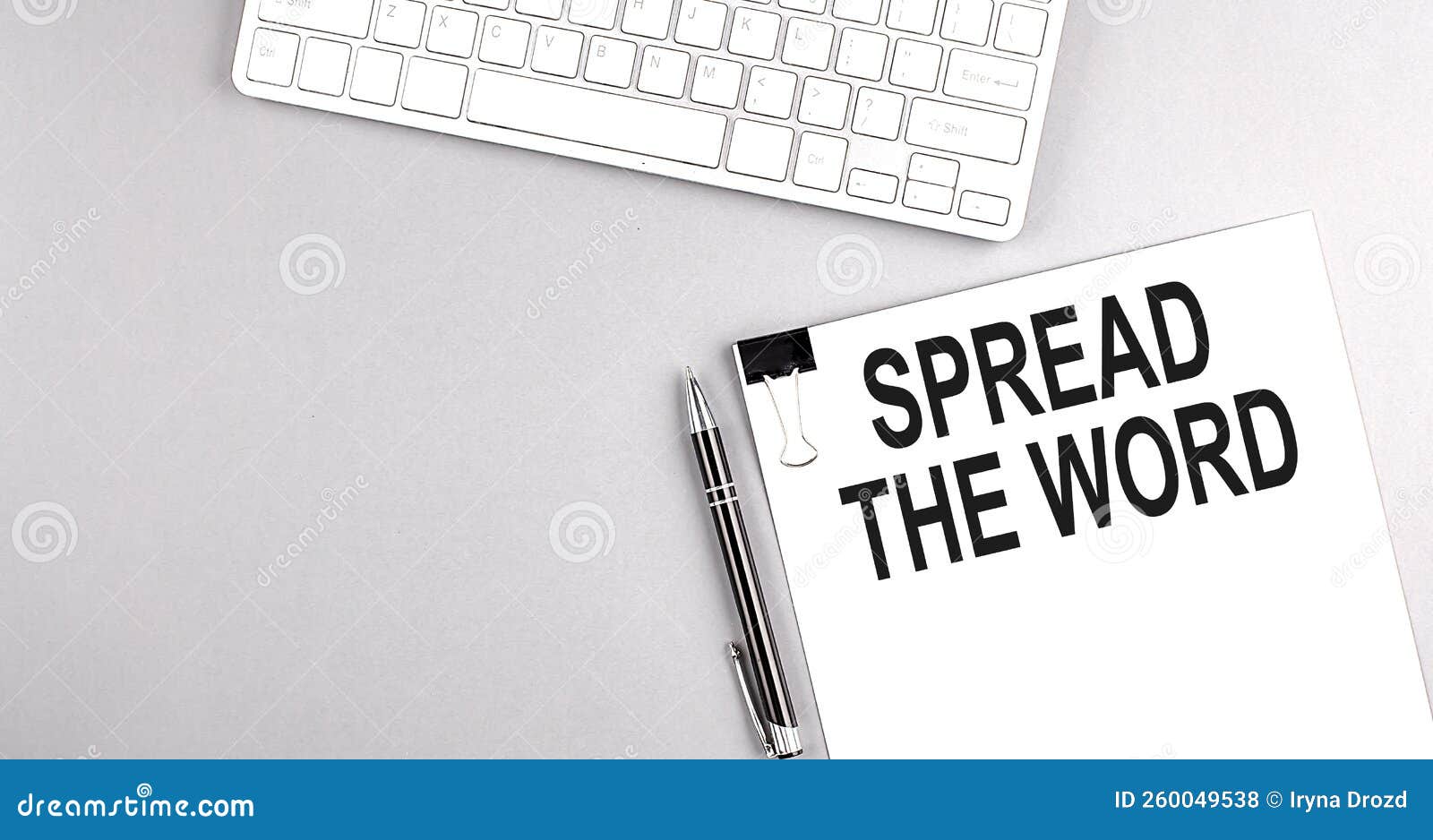 SPREAD the WORD Text on Paper with Keyboard on Grey Background Stock ...