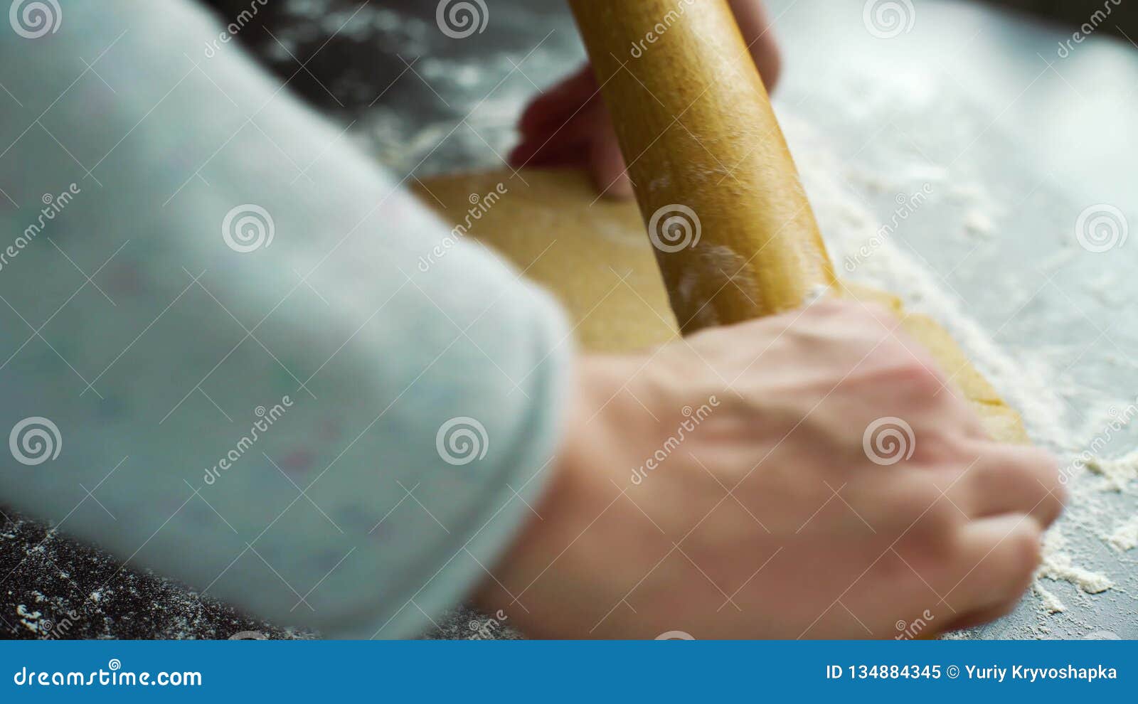 Spreading Flour on Dough and Rolling it with Rolling Pin Closeup Stock ...