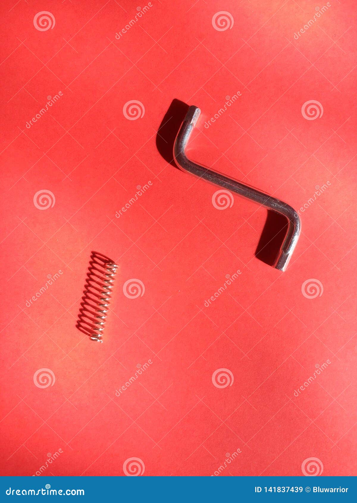 Spring and Allen Key on Red Background Stock Image - Image of spring ...