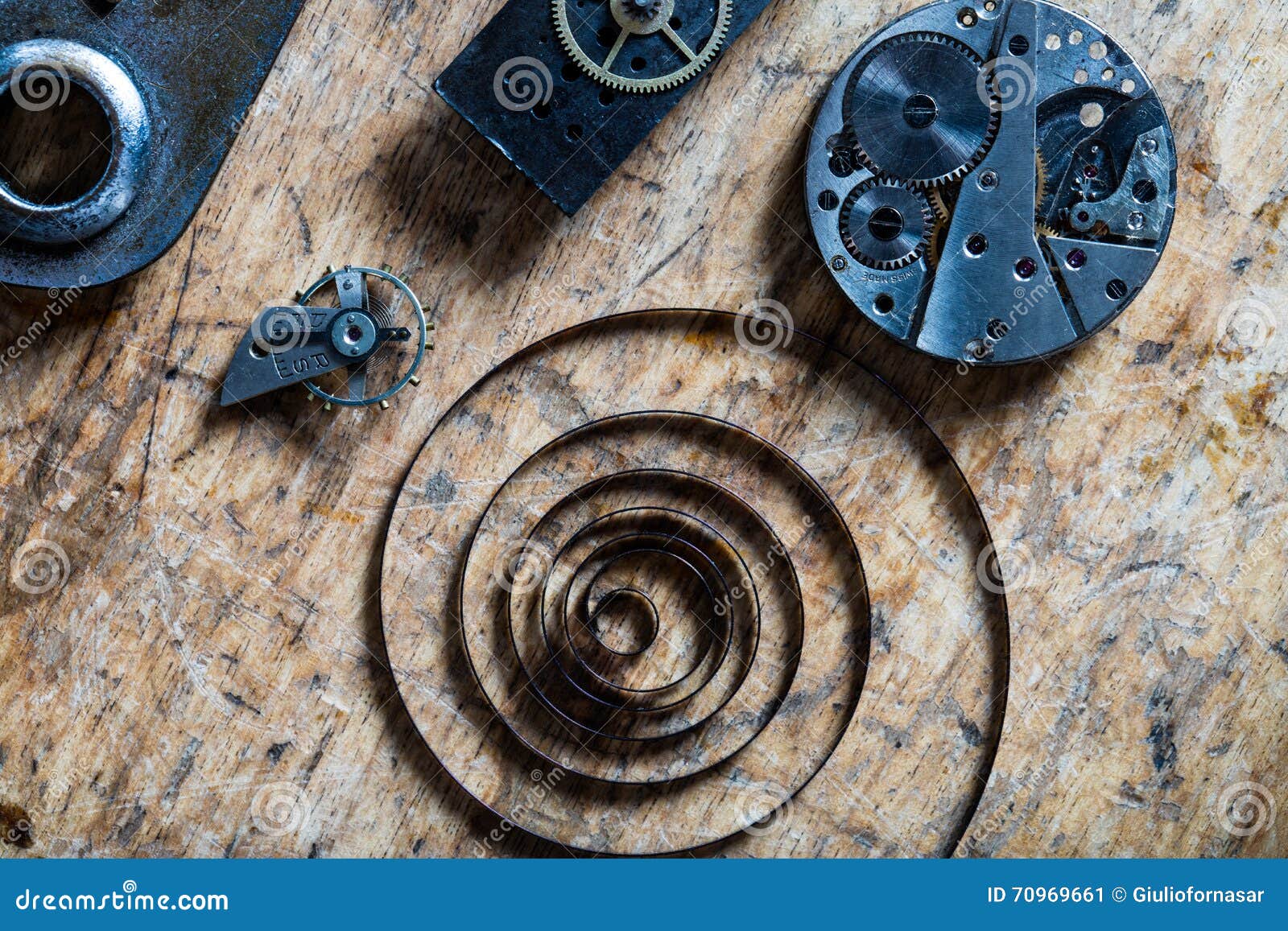 Spring, Balance Wheel and Clockworks on a Table Stock Image - Image of ...