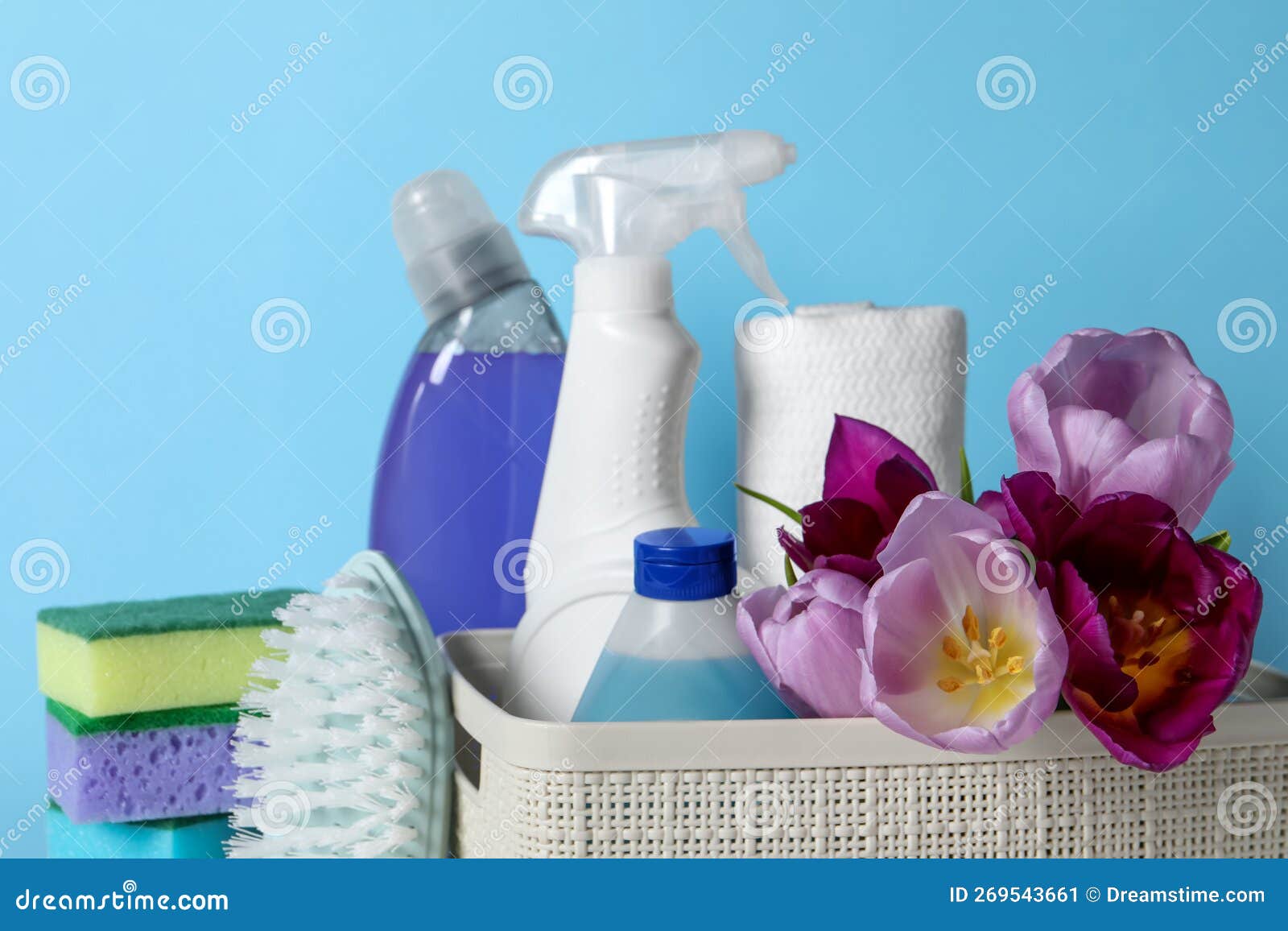 Spring Cleaning. Basket with Detergents, Flowers and Tools on Light ...