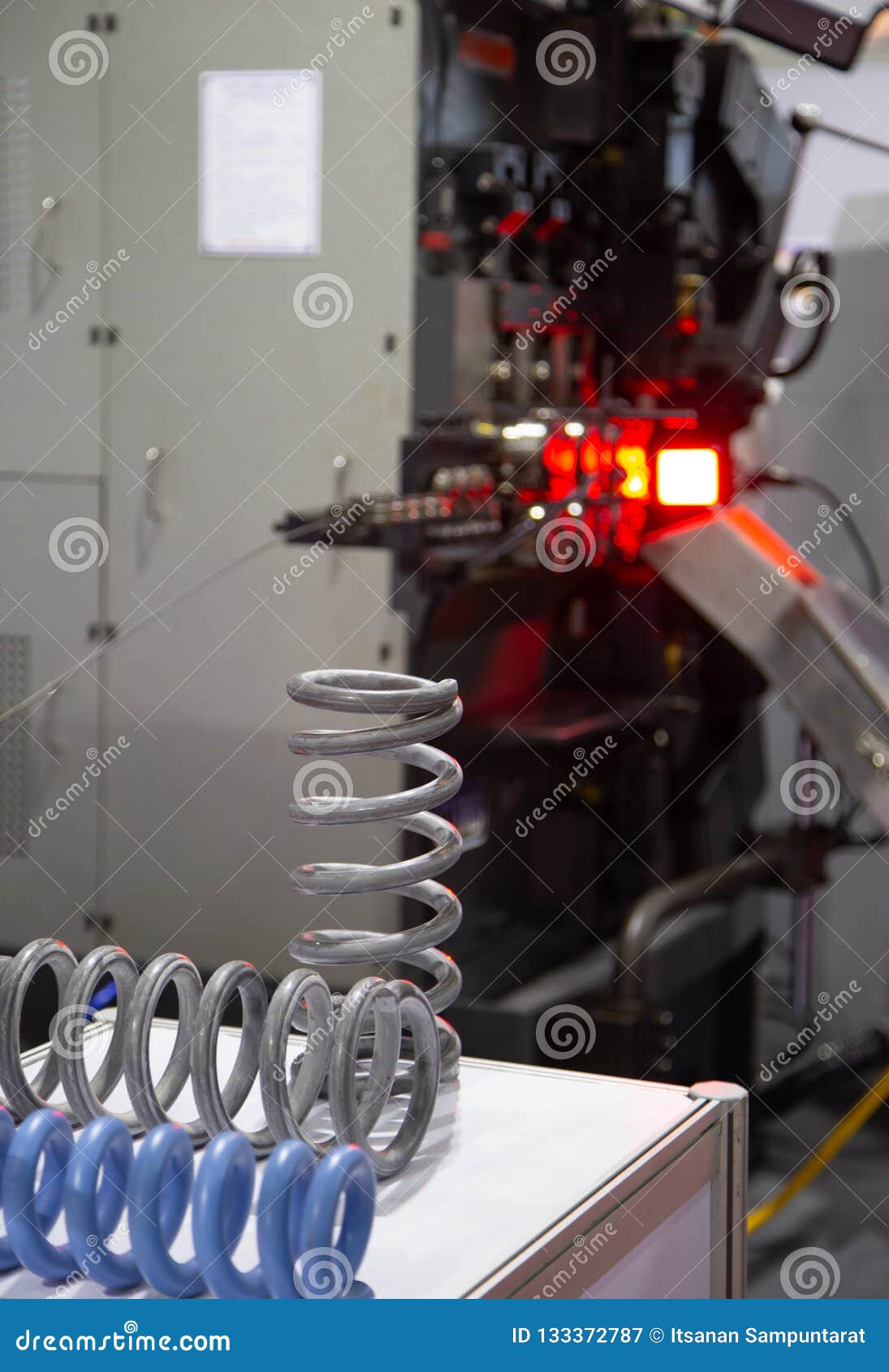 Spring coil production stock image. Image of operate - 133372787