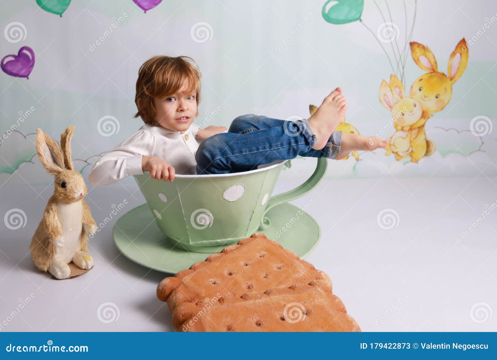 Child in a Tea Cup with Some Biscuits Stock Image - Image of selective ...
