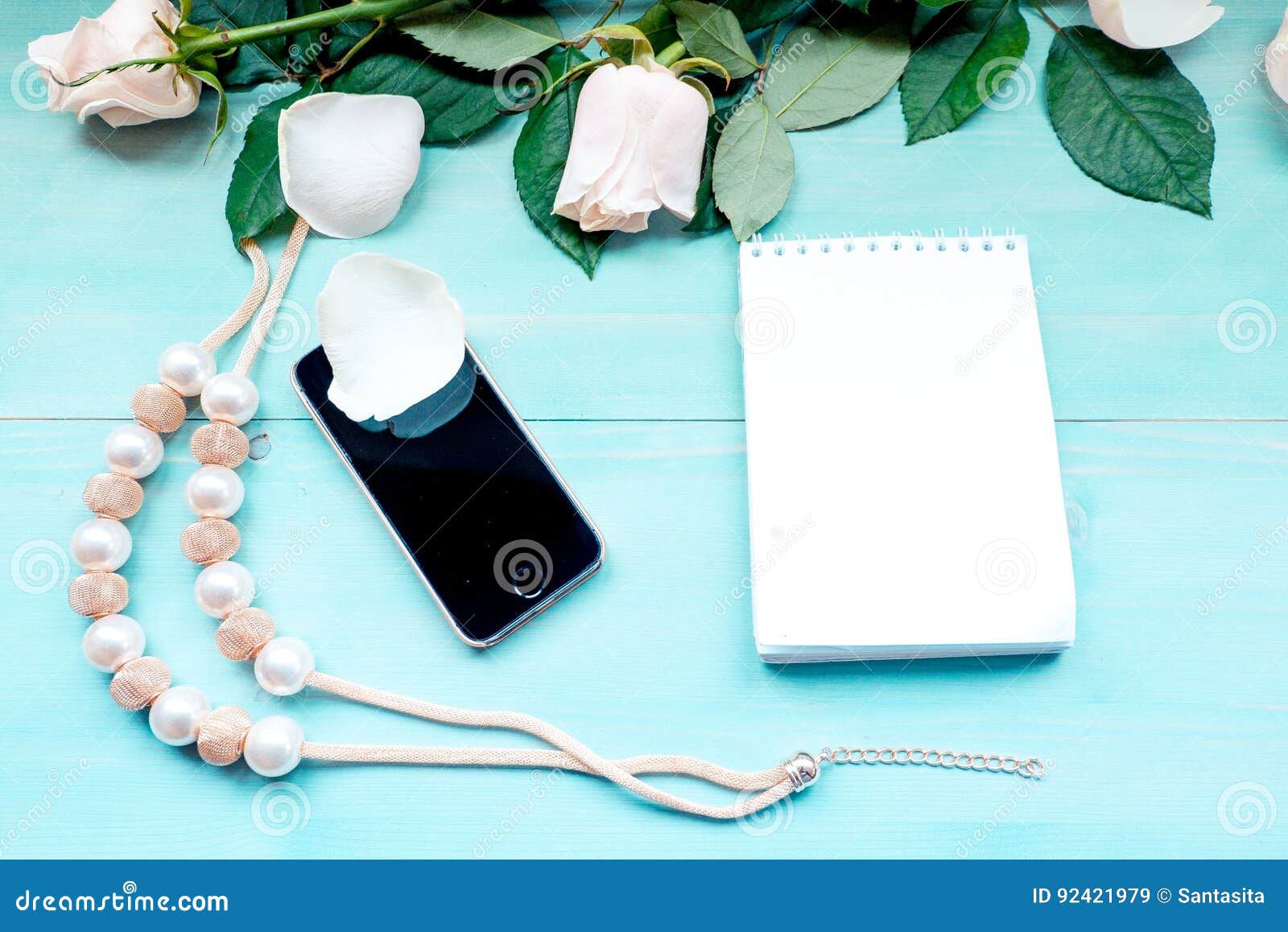 Spring Layout on a Blue Wooden Background with Flowers and Rose Petals ...