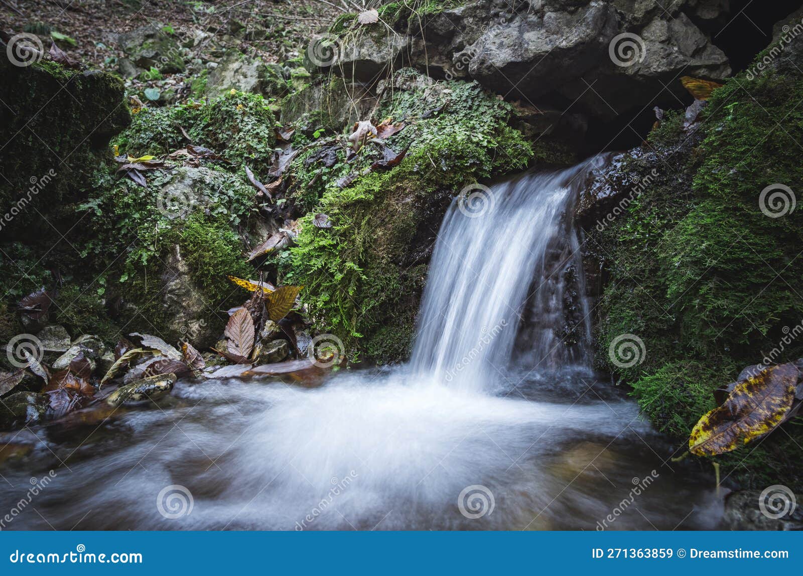 A Spring in the Mountains with Clean Drinking Water Flows from Stones ...