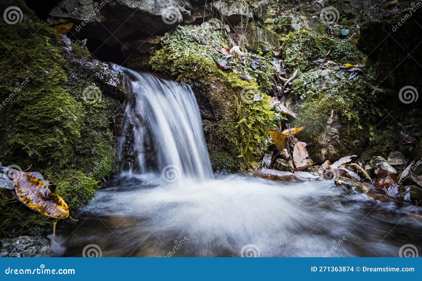 A Spring in the Mountains with Clean Drinking Water Flows from Stones ...