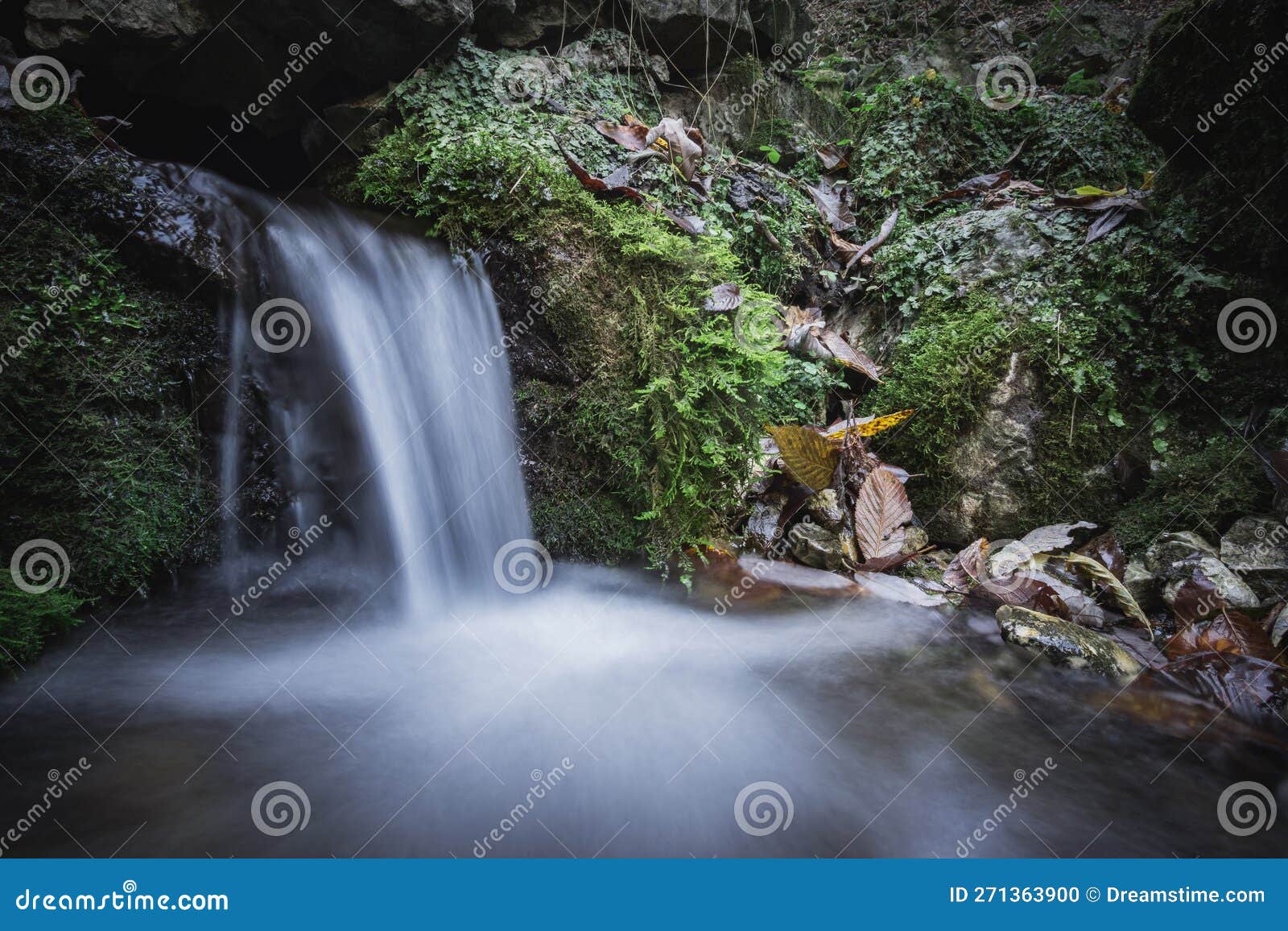 A Spring in the Mountains with Clean Drinking Water Flows from Stones ...