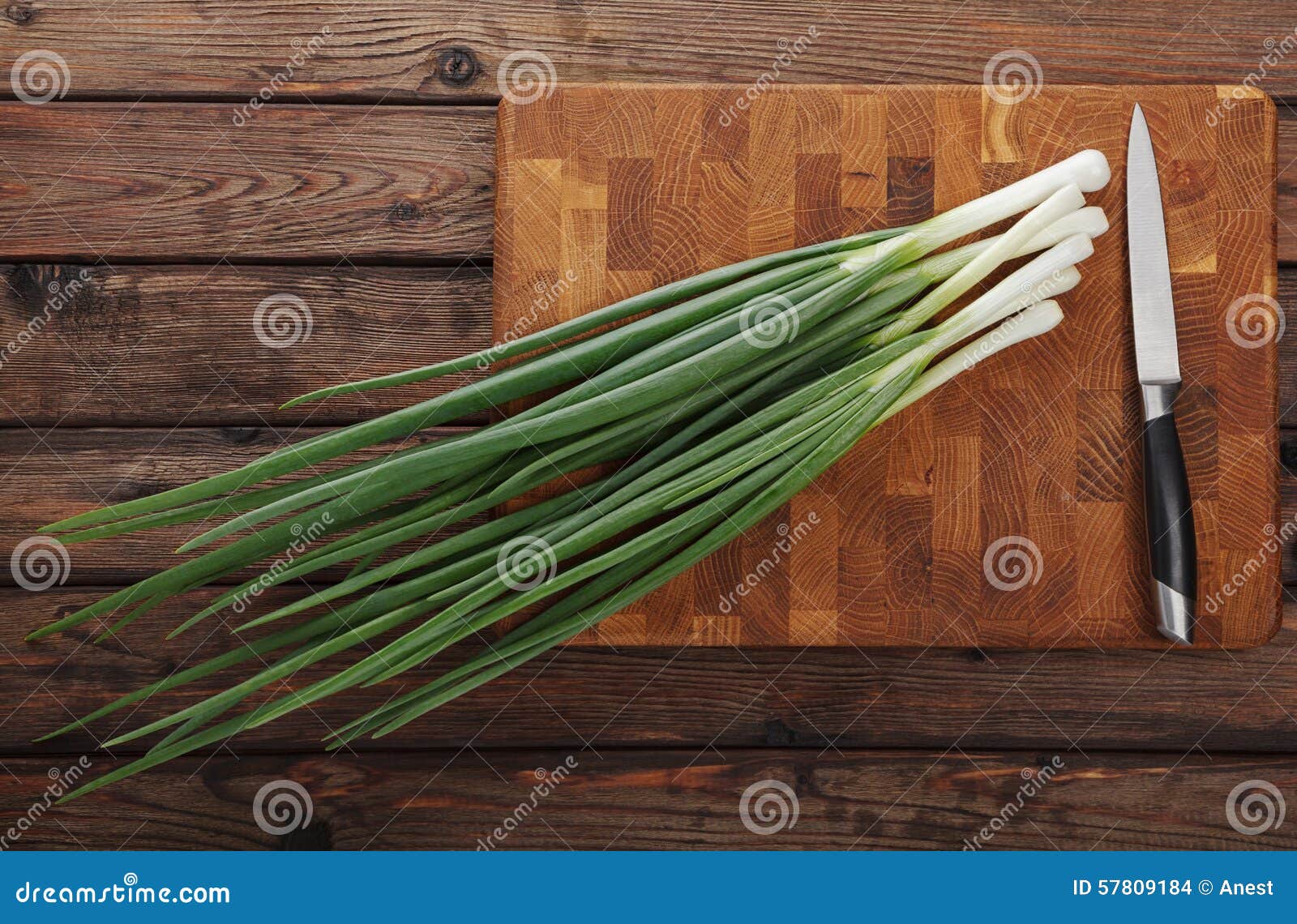 Spring Onions and Knife on Chopping Block Stock Photo - Image of food ...