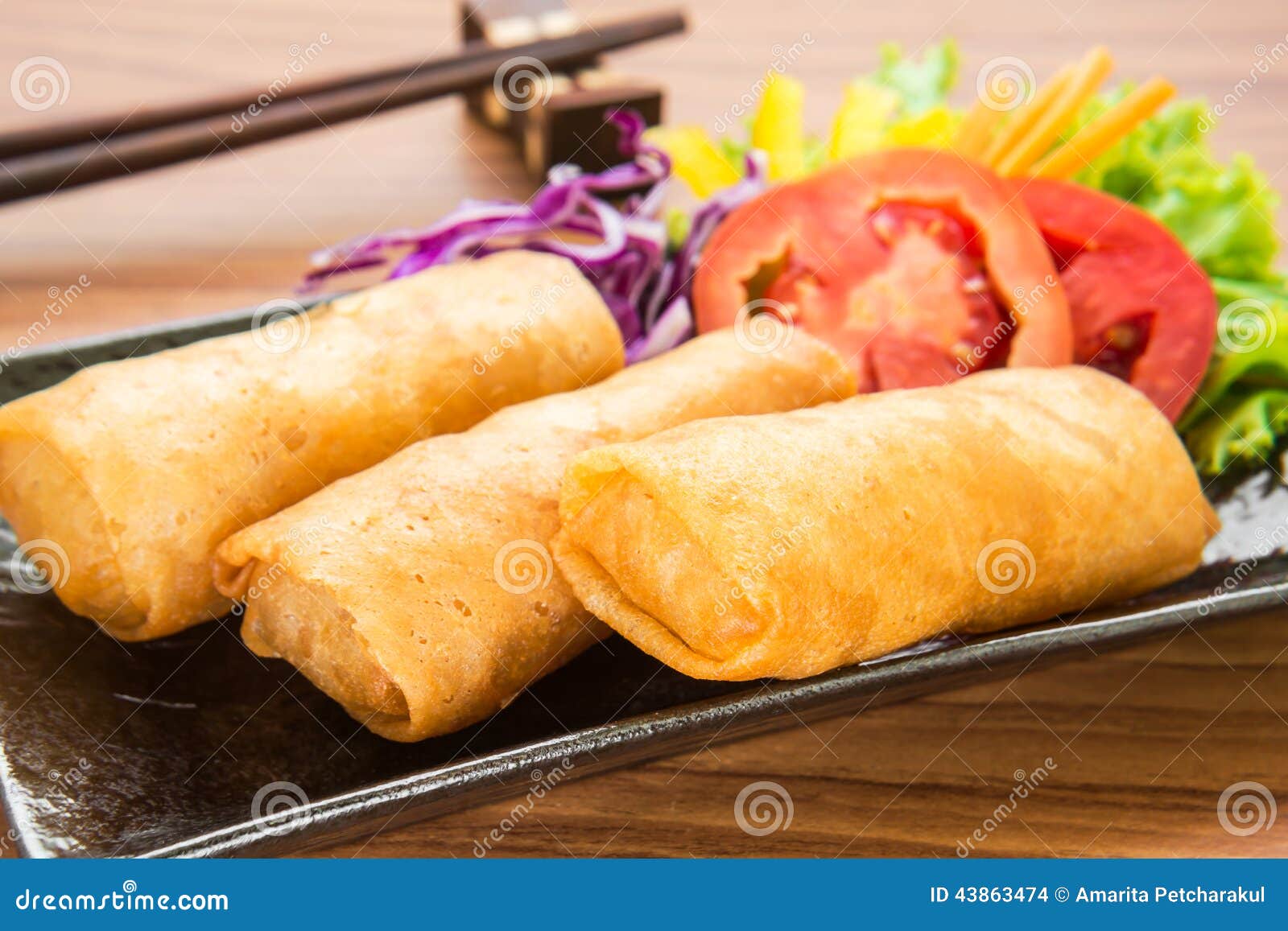Spring rolls on dish stock photo. Image of plate, tasty - 43863474