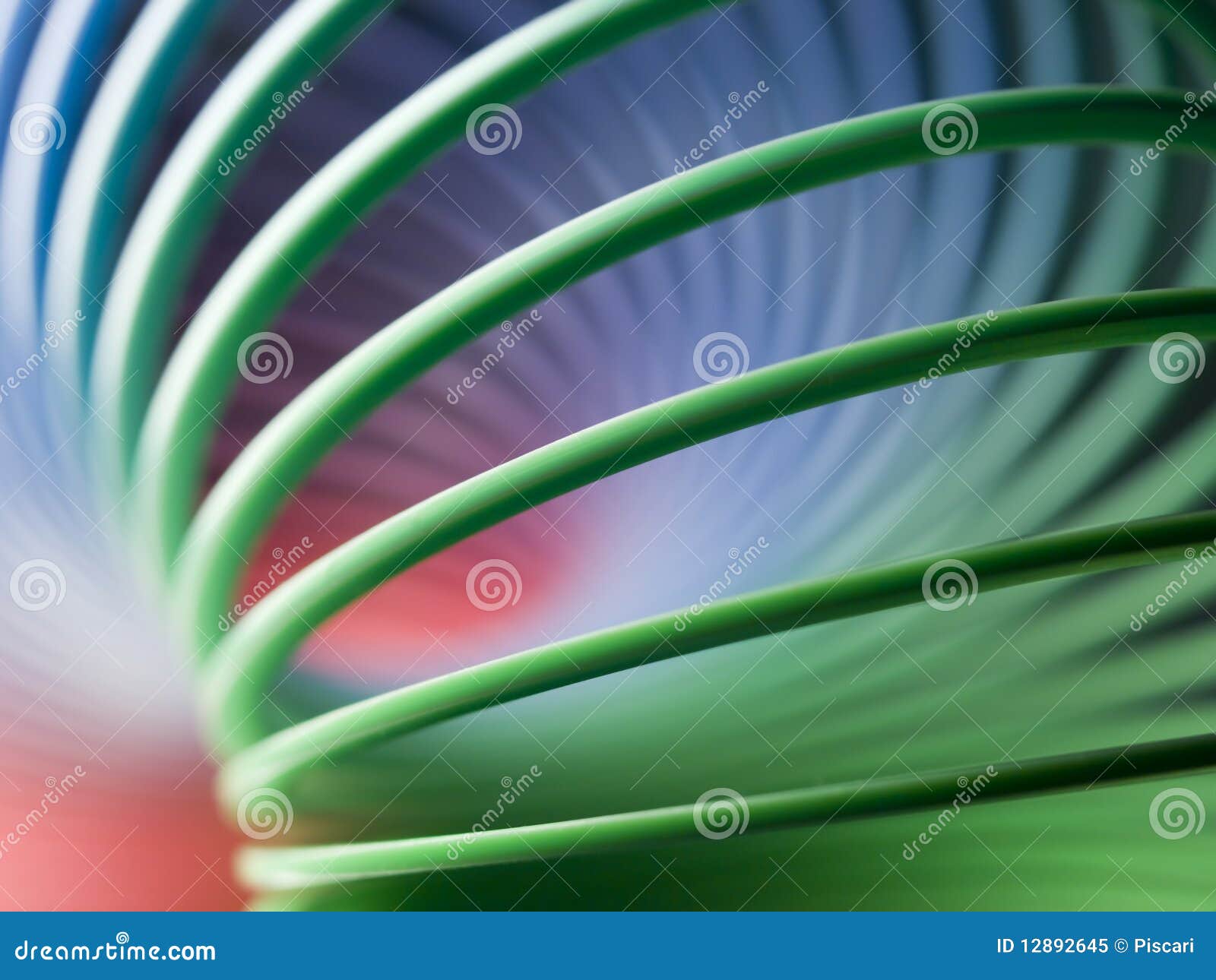 Spring slinky background editorial image. Image of spiral - 12892645
