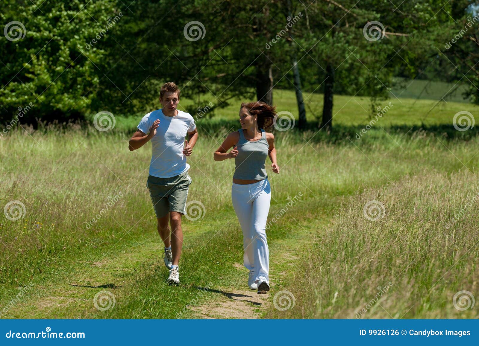 Spring - Sportive Couple Jogging in Nature Stock Photo - Image of young ...