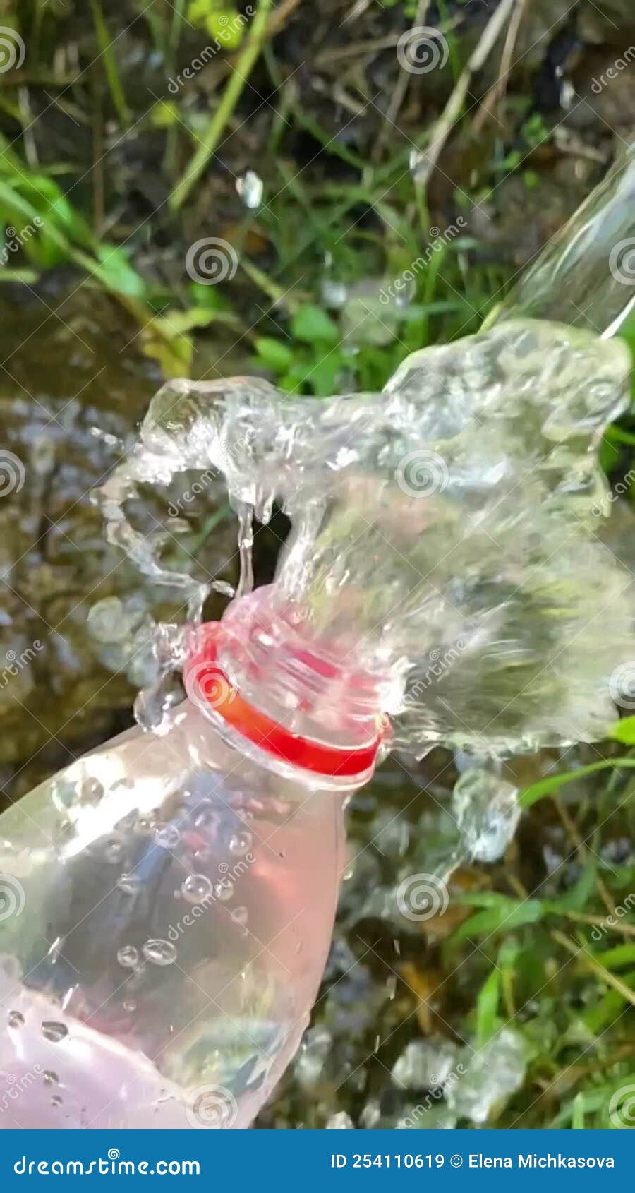 Spring Water Flows into a Bottle. Flying Splashes of Water Stock Video ...