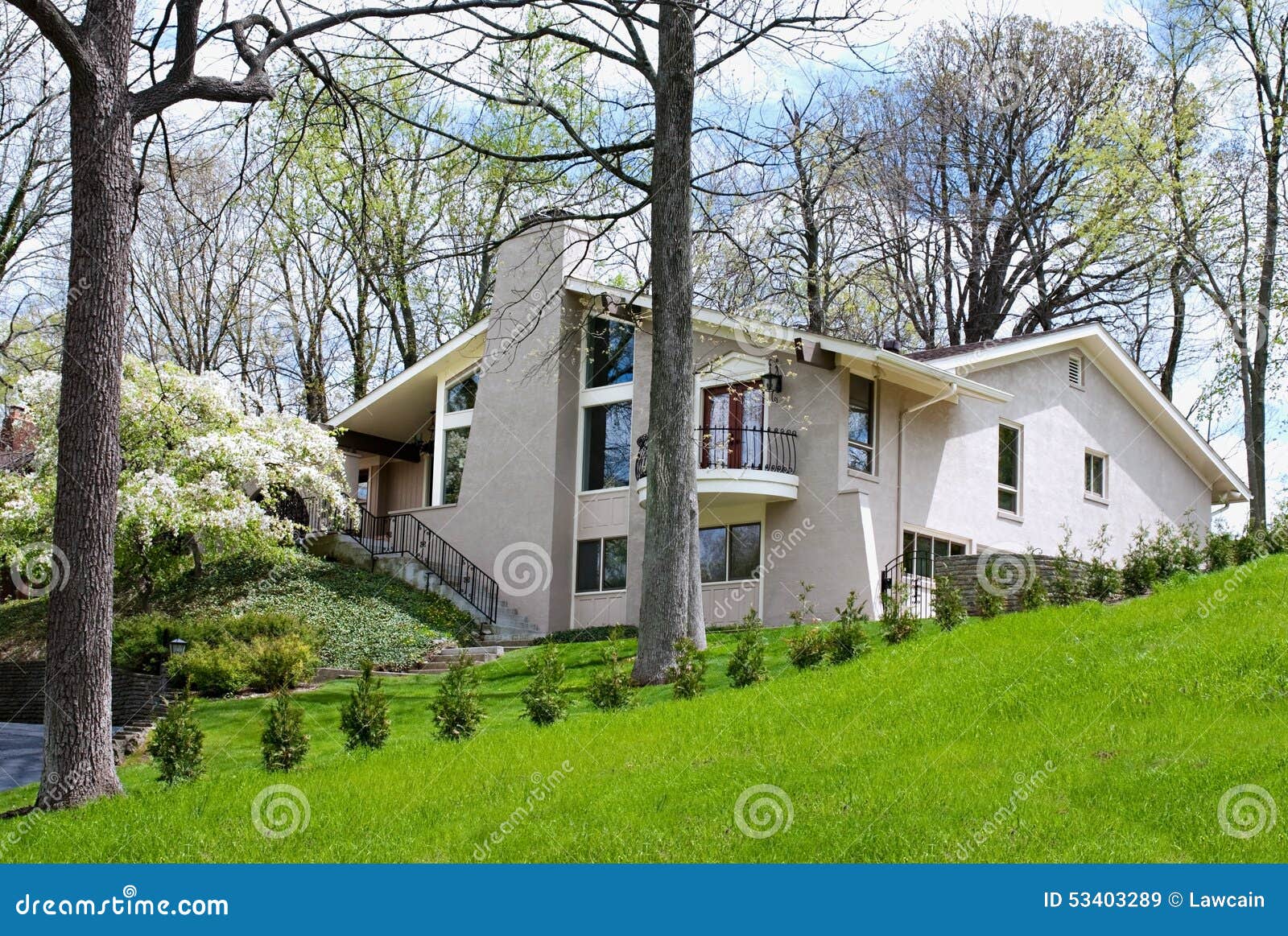 Springtime Stucco House on Hill Stock Image - Image of blossom, house ...