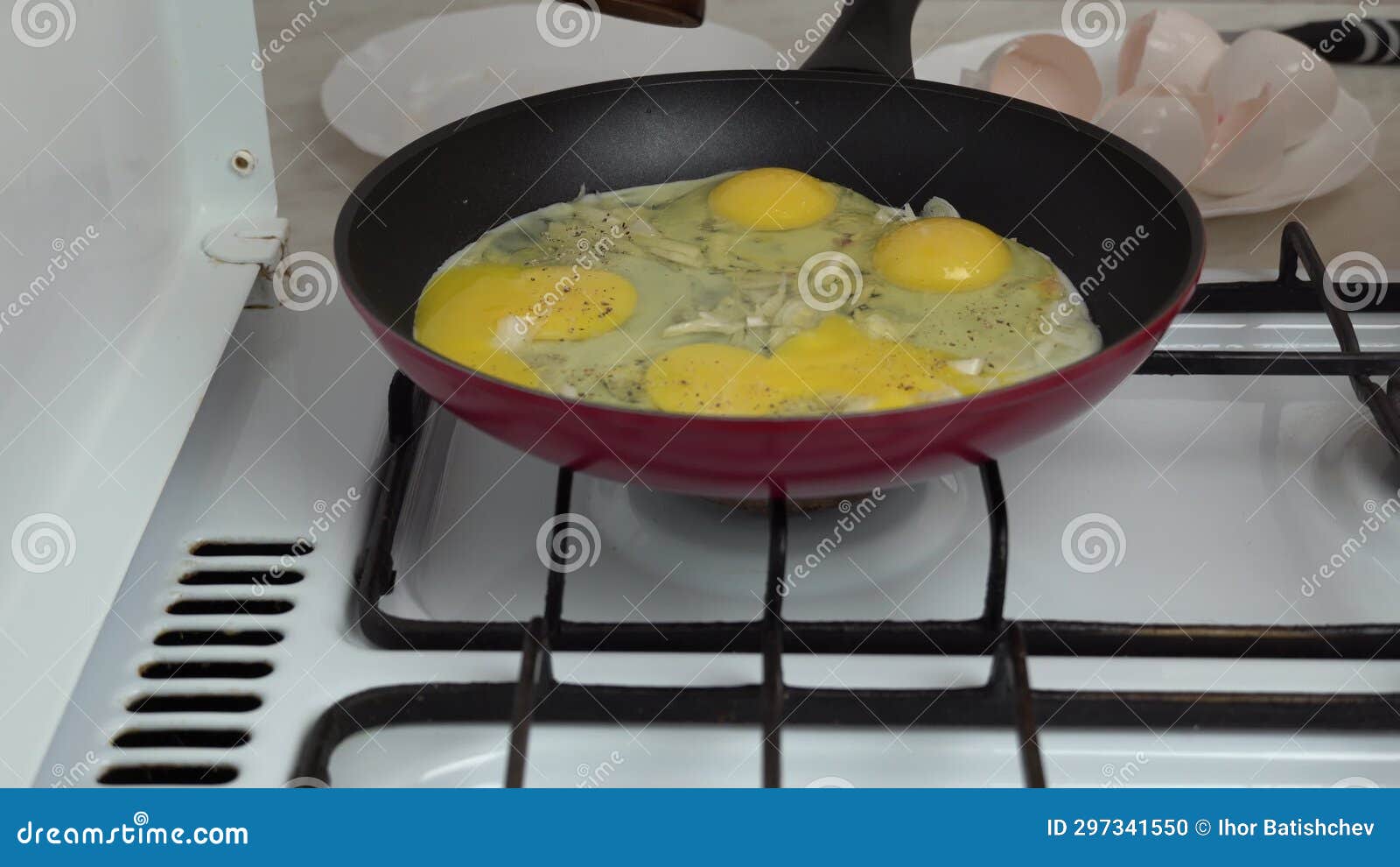 Sprinkle Black Pepper and Cook Fried Eggs with White Onion. Stock ...