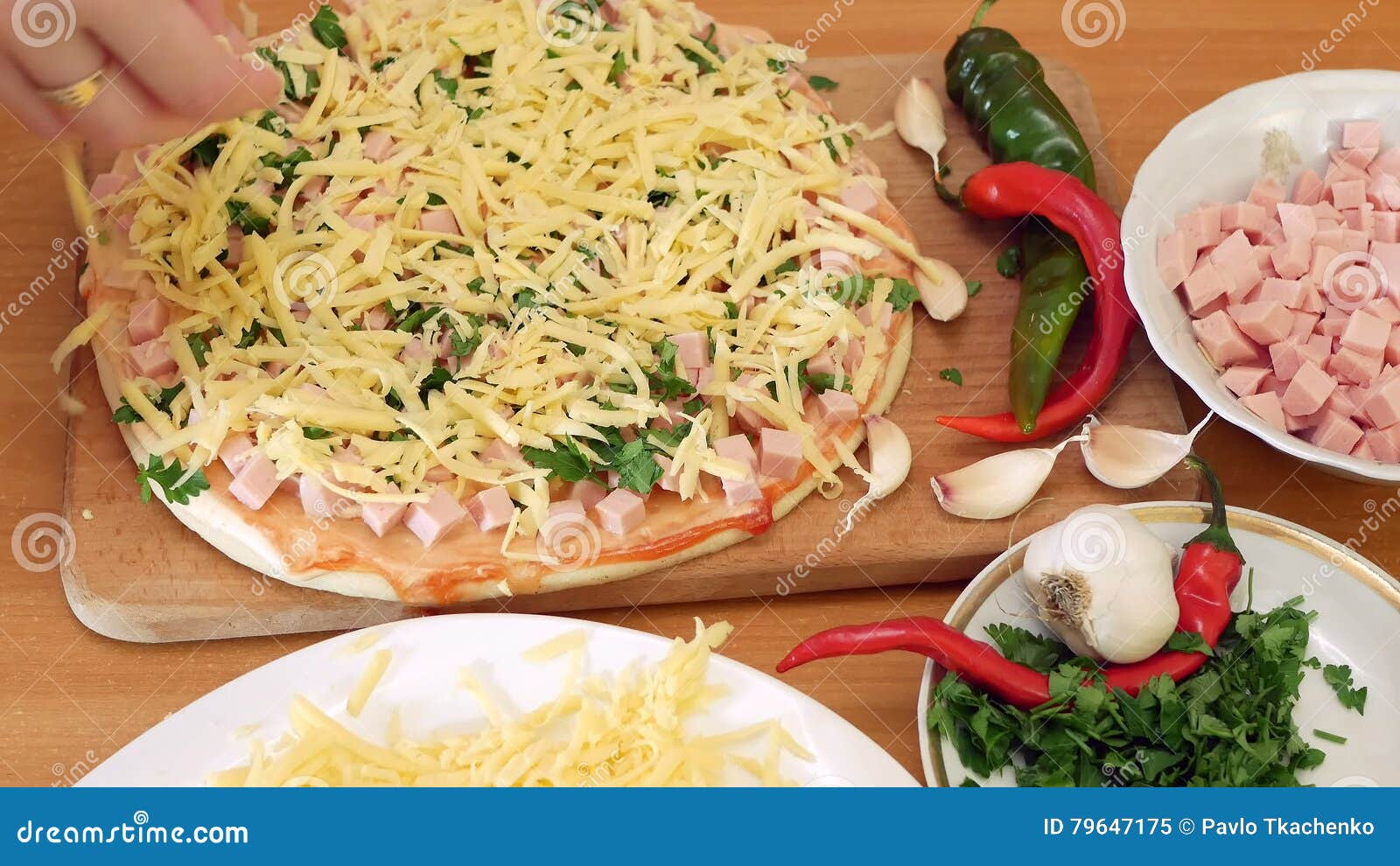 Sprinkle cheese on a pizza stock video. Video of person - 79647175