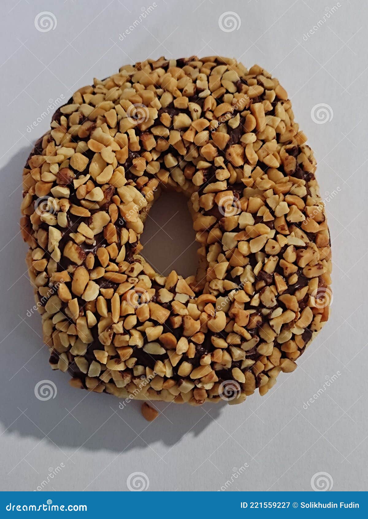 Sprinkle of Nuts on Top of the Donut Stock Image - Image of donut ...