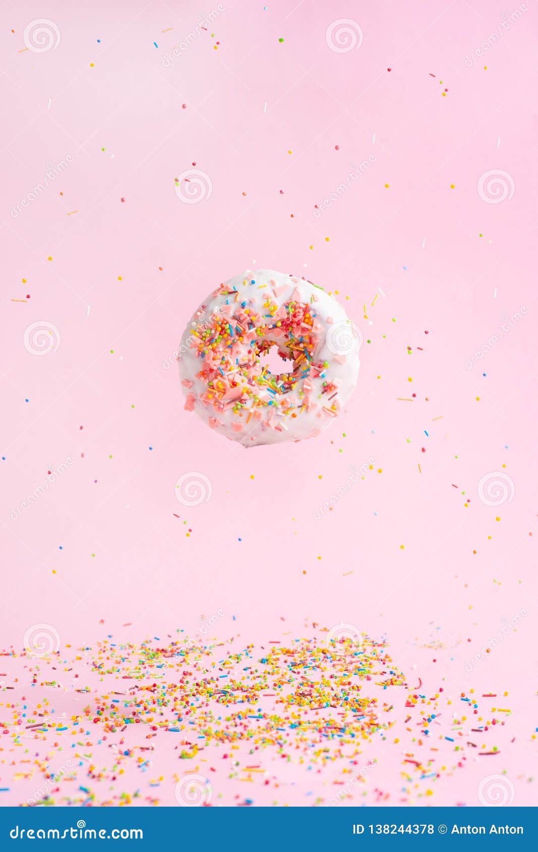 Sprinkle Pink Donut. Multi-colored Sprinkle Donut on a Pink Background ...