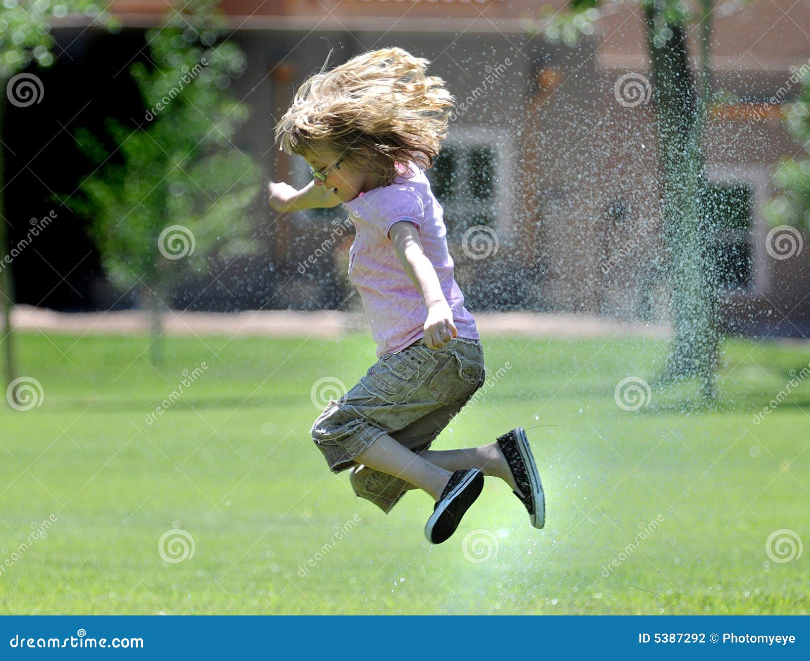 Sprinkler Fun stock photo. Image of caucasian, jovial - 5387292