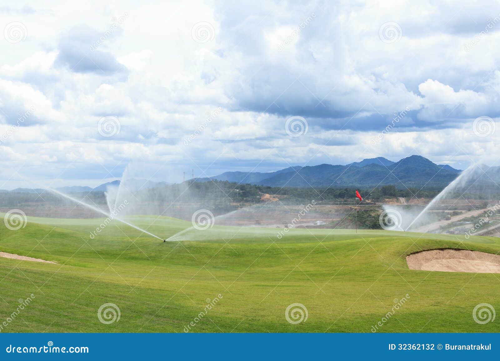 Sprinklers on golf course stock photo. Image of lush - 32362132