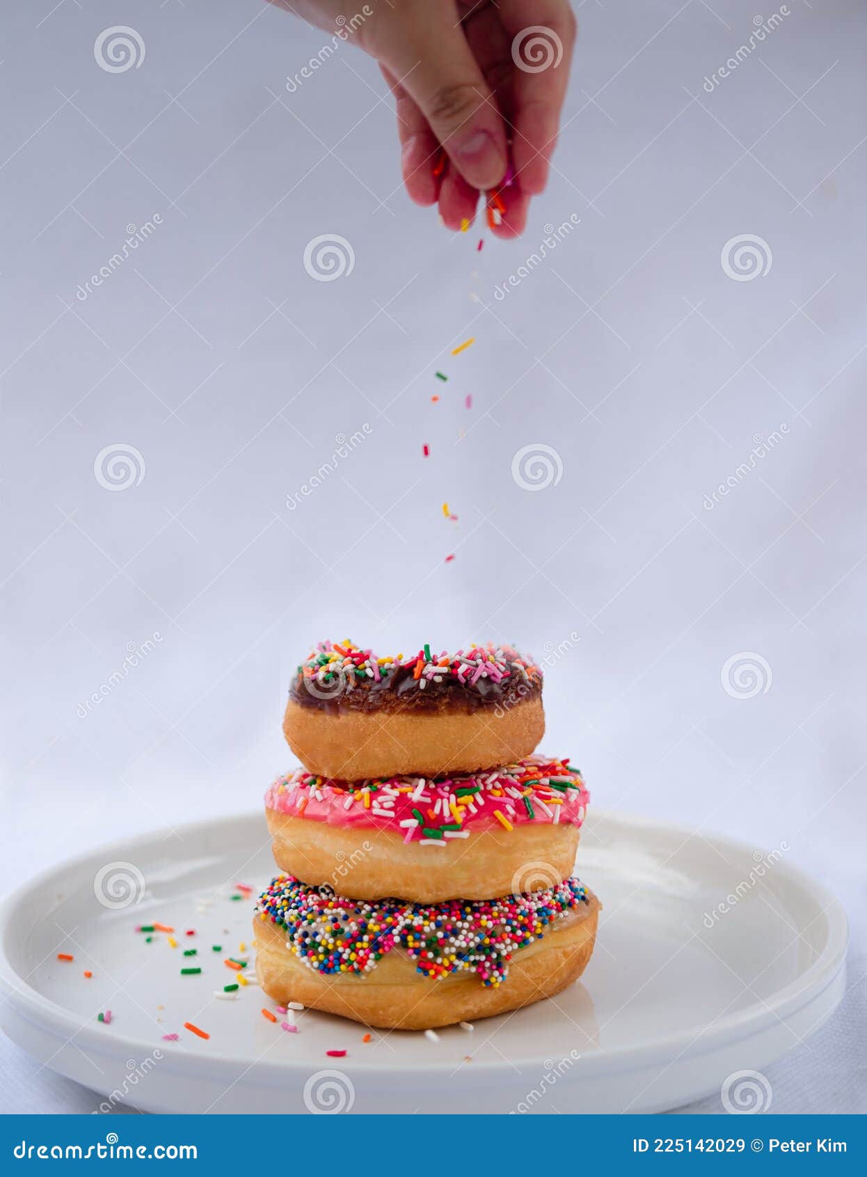 Sprinkles Falling on Some Donuts. Stock Image - Image of pink, icing ...