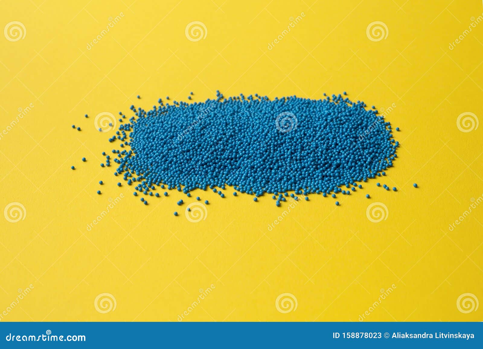 Sprinkle of Blue Balls on a Yellow Background Stock Image - Image of ...