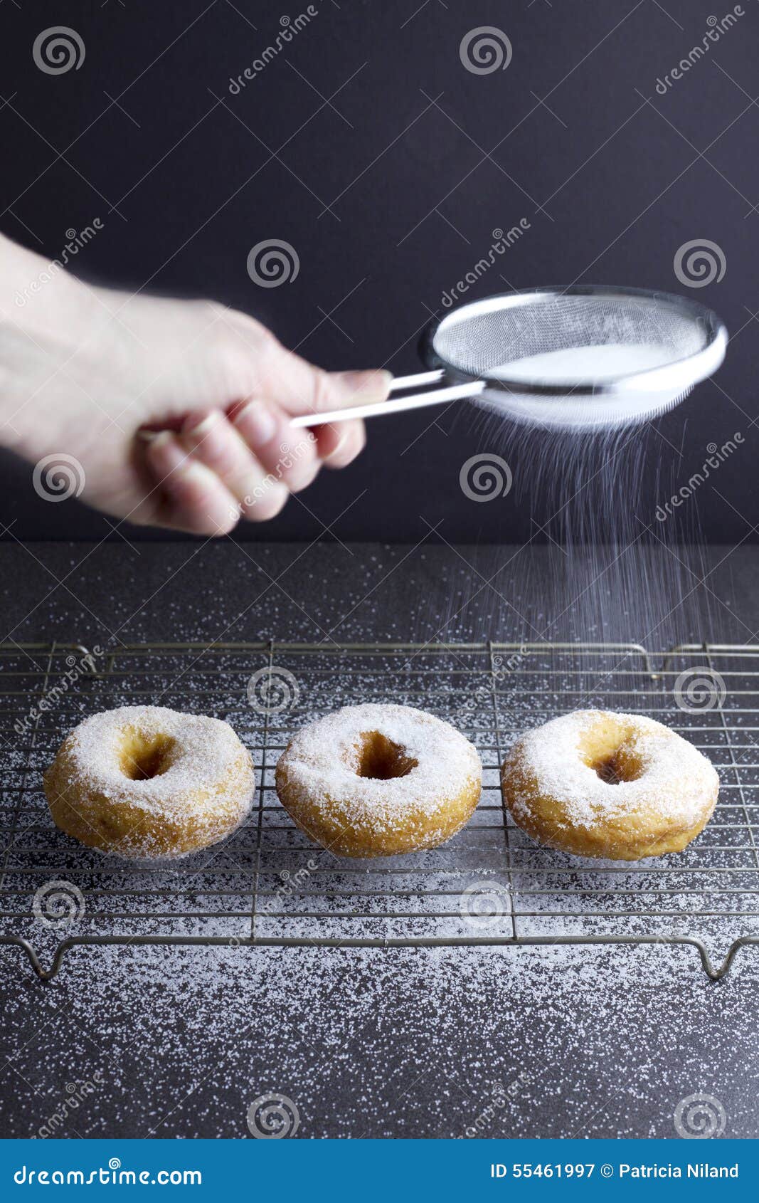Sprinkling Sugar on 3 Ring Doughnuts Stock Image - Image of busy ...