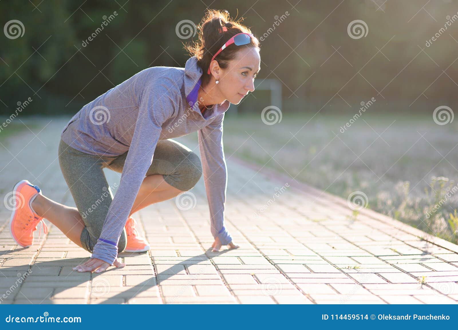 Sprinter Girl Start Position on the Track. Jogging Sport Stock Photo ...