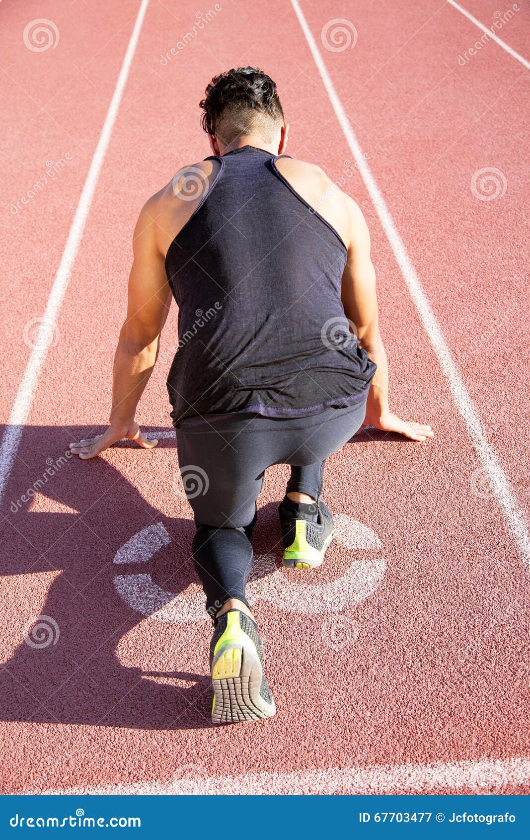 Sprinter Leaving Starting Blocks On The Running Track. Explosive Start ...