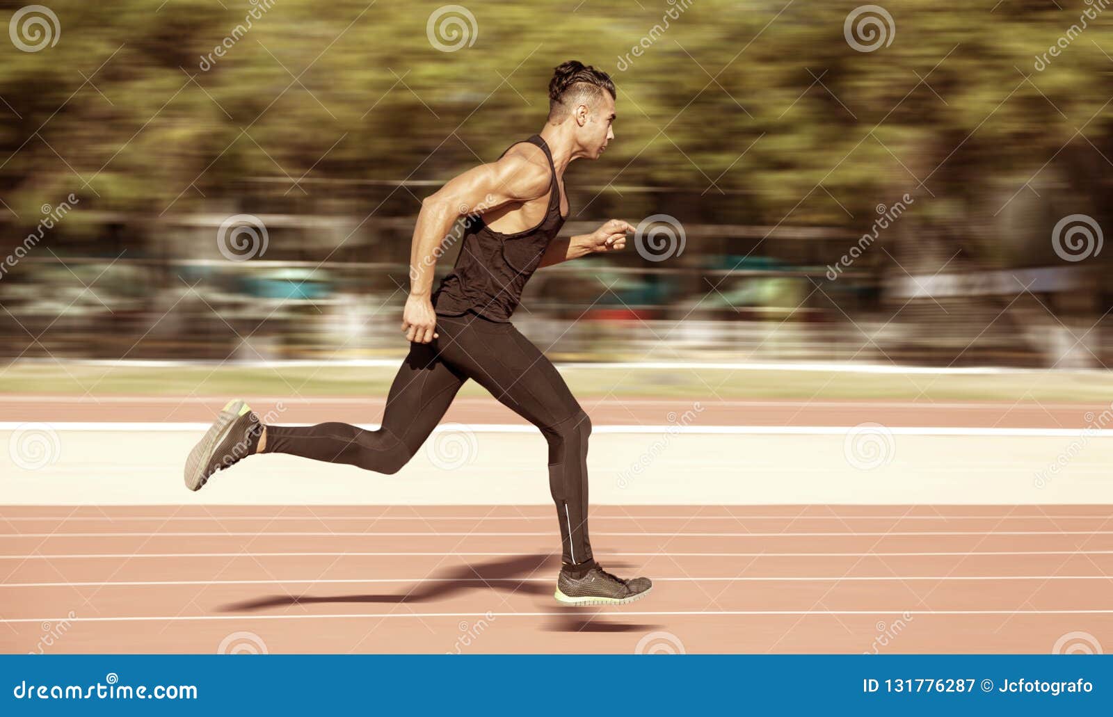 Sprinter Leaving Starting Blocks on the Running Track. Explosive Stock ...