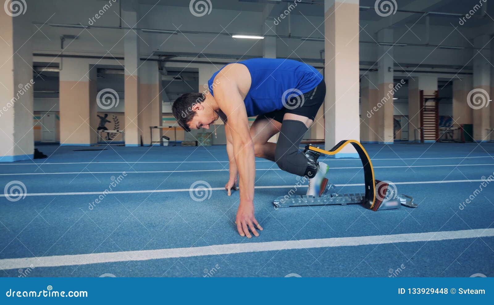 Sprinter Starts To Run, Wearing a Leg Prosthesis, Side View. Stock ...