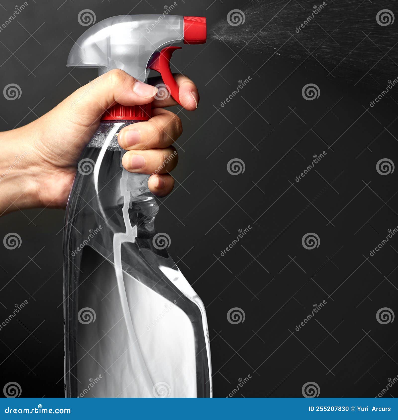 Spritz and Spray. a Person Spraying from a Bottle of Detergent Isolated ...
