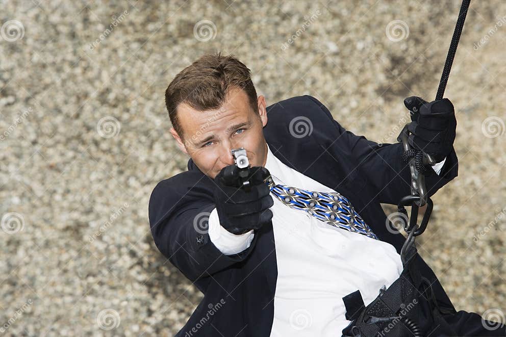 Spy Rappelling and Aiming Gun Stock Image - Image of operative ...
