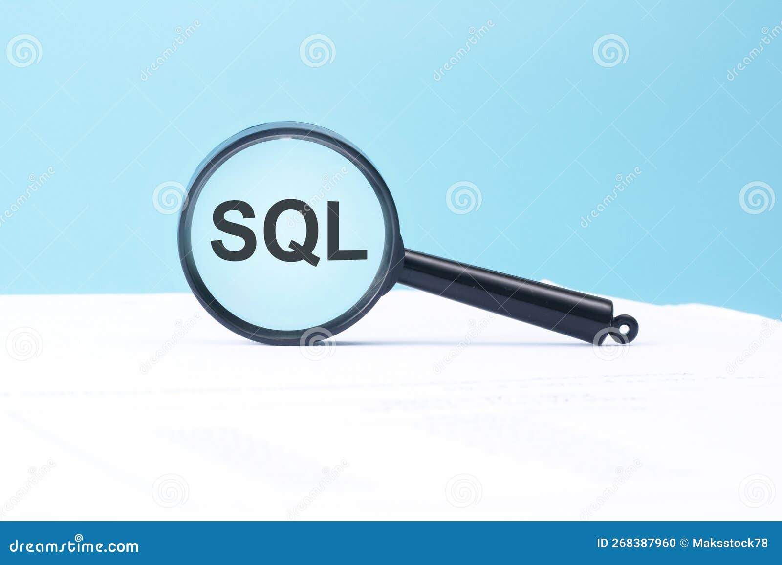 Look at the Text SQL through a Magnifying Glass on a Blue and White ...