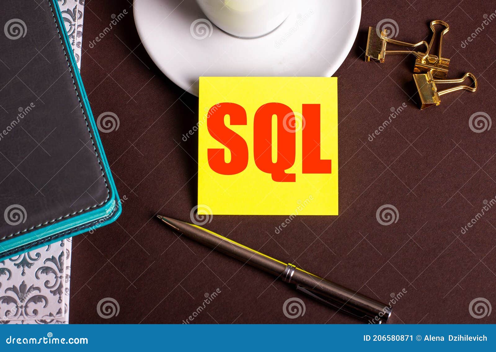 SQL Written on Yellow Paper on a Brown Background Near a Coffee Cup and ...