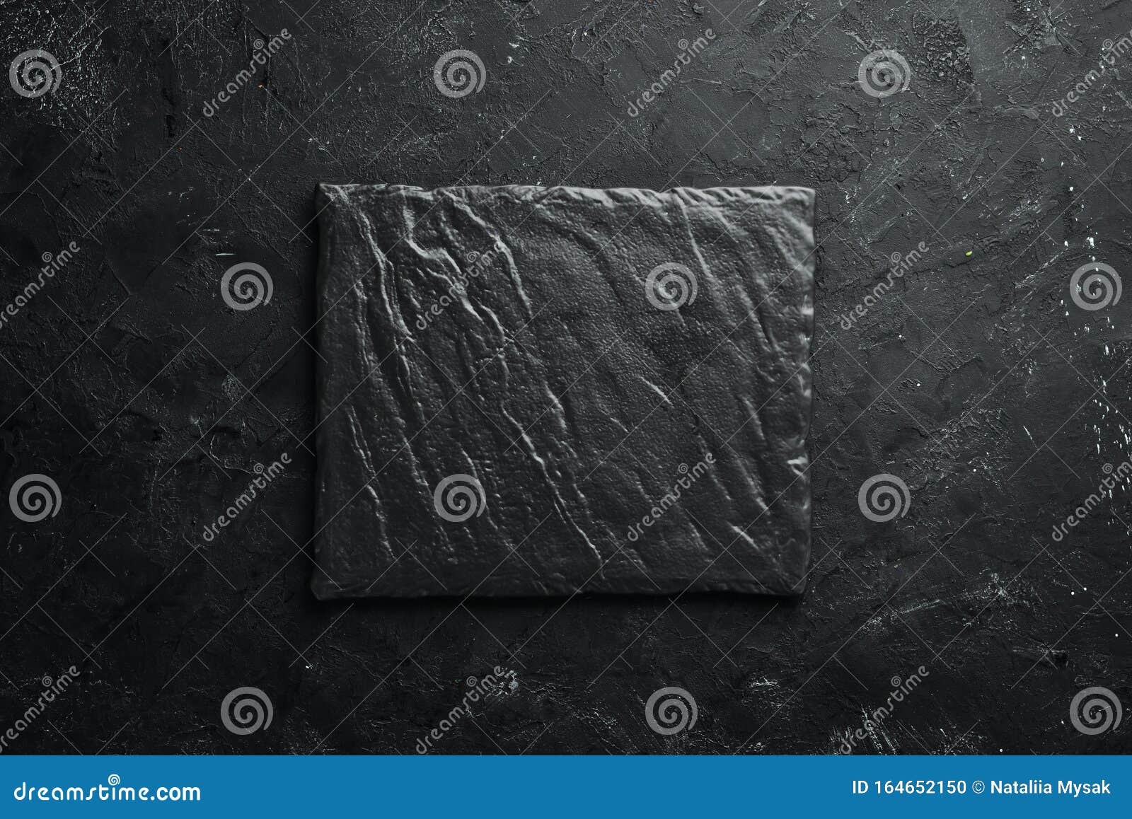 Square Black Stone Dish. on a Black Stone Background. Top View Stock ...